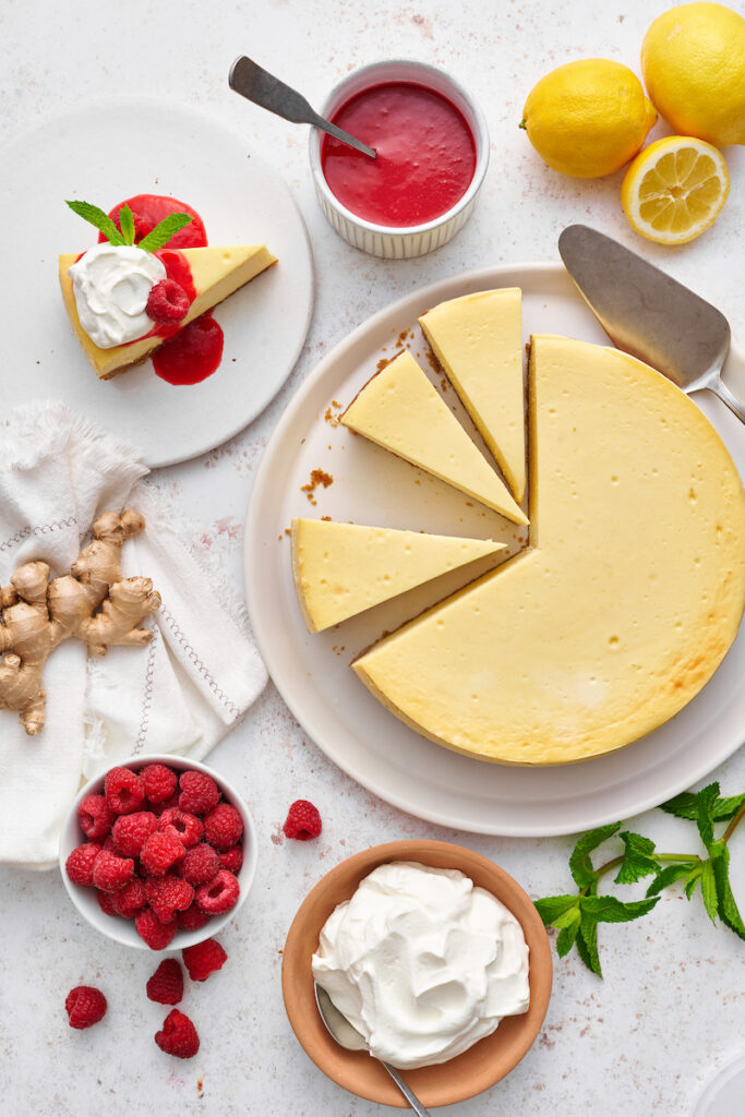 Lemon Ginger Cheesecake with Raspberry Sauce - Baker by Nature